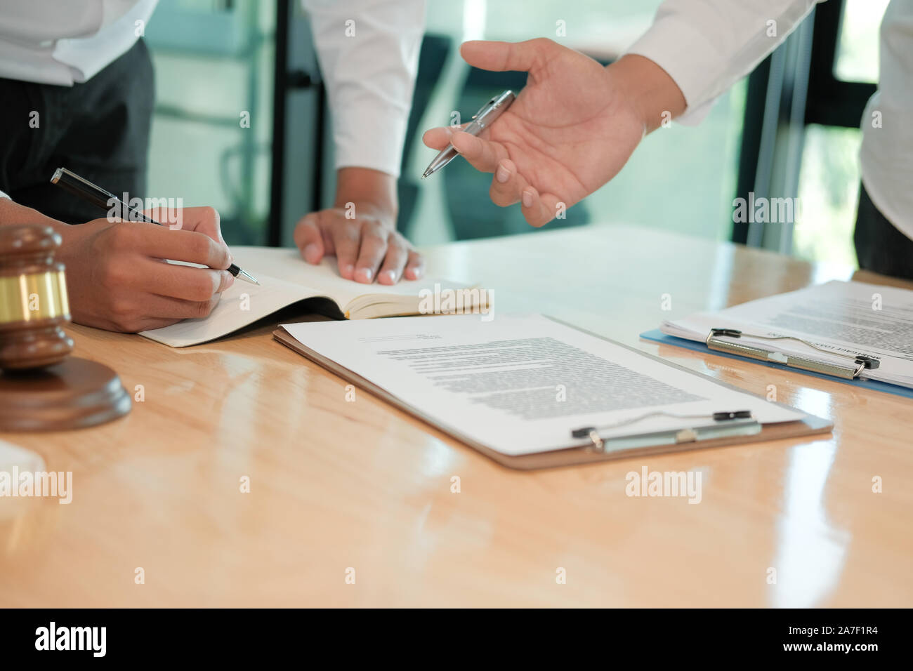 lawyer giving advice to a man. businessman discussing legal legislation ...