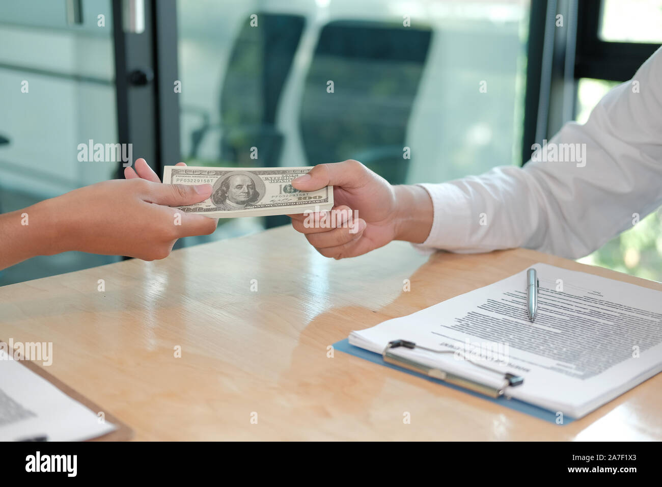 Woman giving a man money hi-res stock photography and images - Alamy