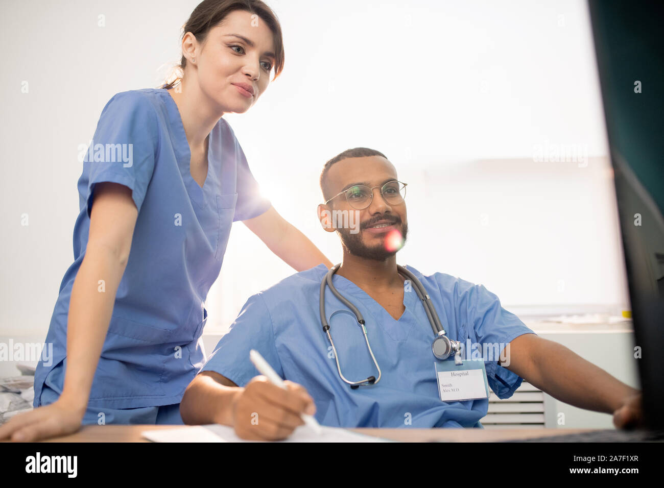Nurse doctor looking computer screen hi-res stock photography and ...