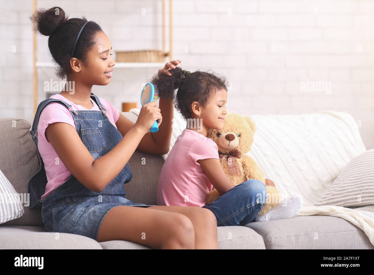 Child taking care of sibling hi-res stock photography and images - Alamy