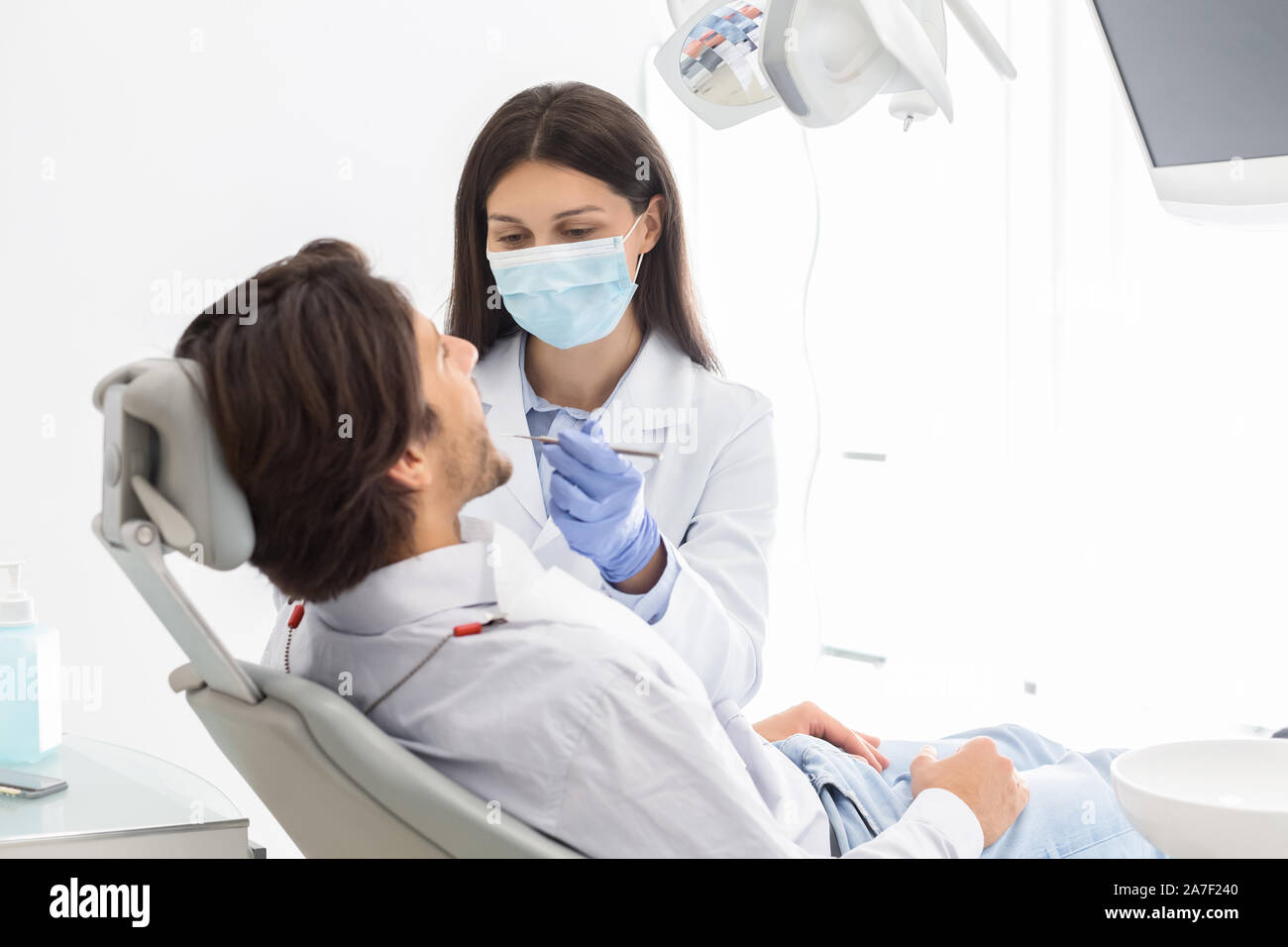 Man having check up in new dental office Stock Photo - Alamy