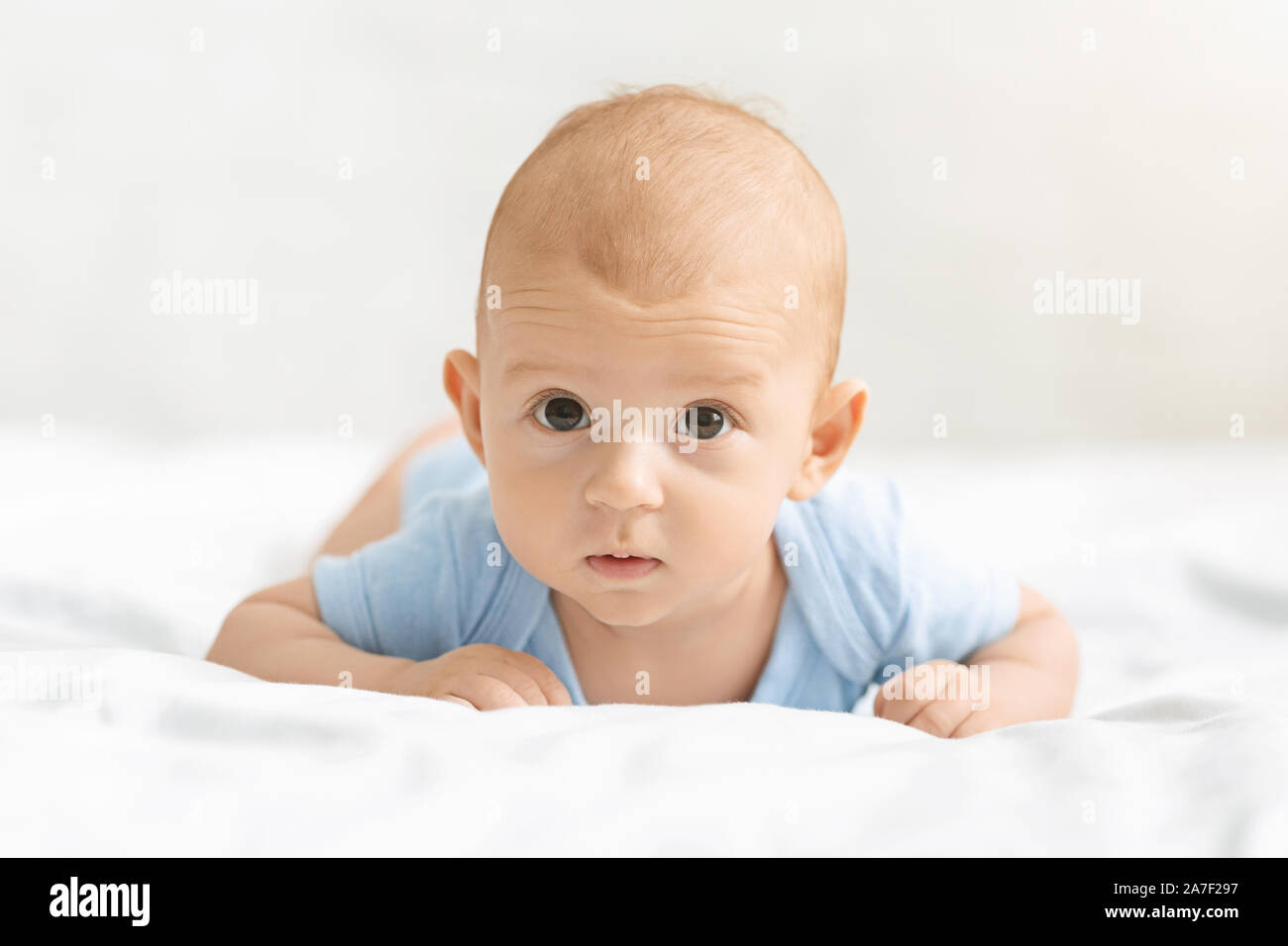 Baby boy on tummy looking hi-res stock photography and images - Alamy