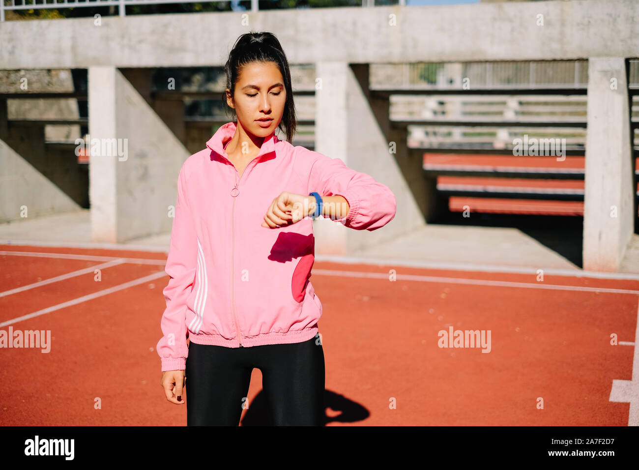 Active girl uses fitness tracker smart watch Stock Photo - Alamy