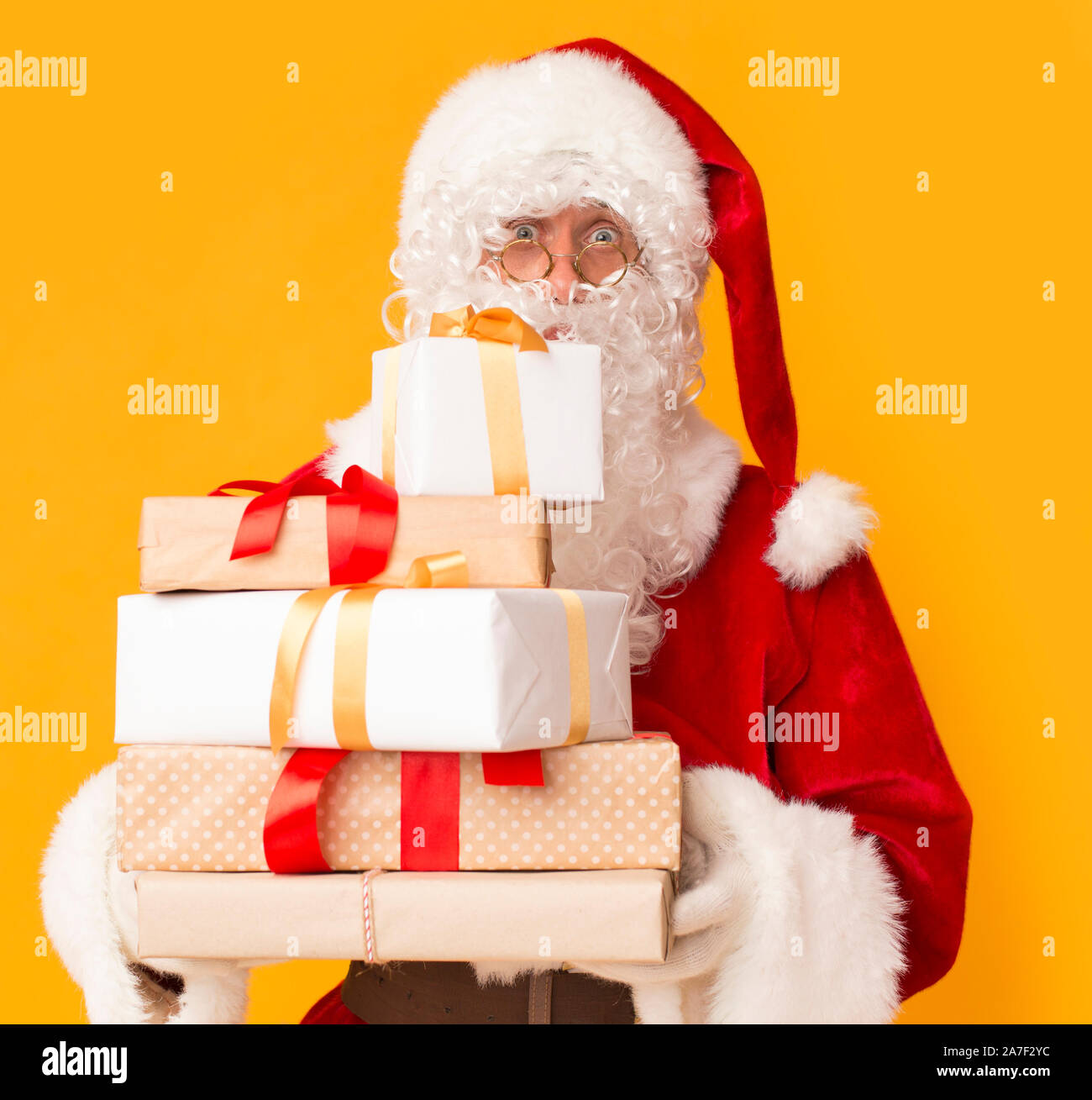 Santa holding present hi-res stock photography and images - Alamy