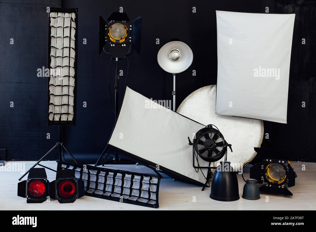 Photo studio equipment flash accessories photographer on black ...
