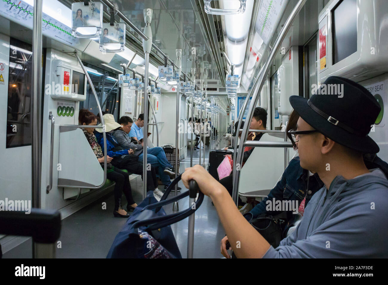Commuters inside shanghai metro train hi-res stock photography and ...