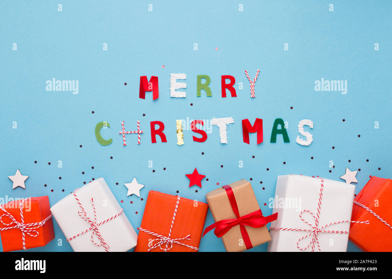 Christmas background with present boxes and colored text Stock Photo ...