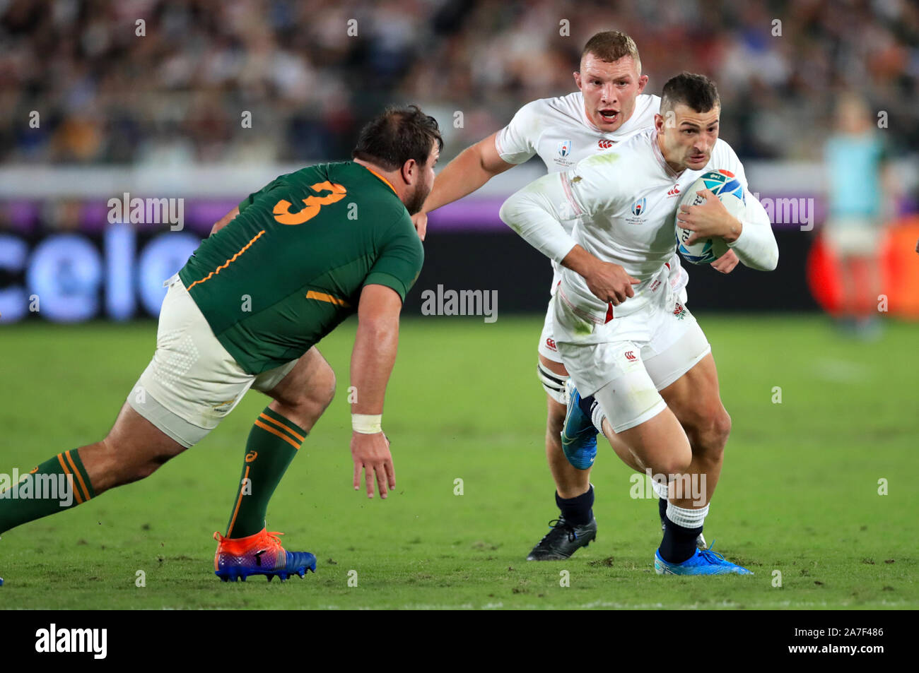 England's Jonny May (centre) is challenged by South Africa's Frans ...