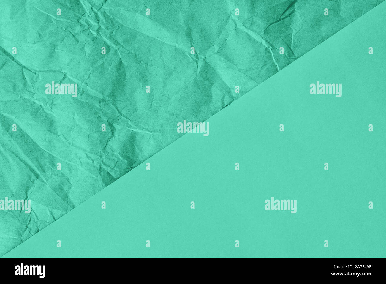 Crumpled and plain paper sheets divided diagonaliy creating line ...