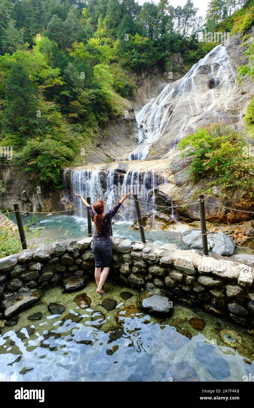 Back facing the rocks hi-res stock photography and images - Alamy