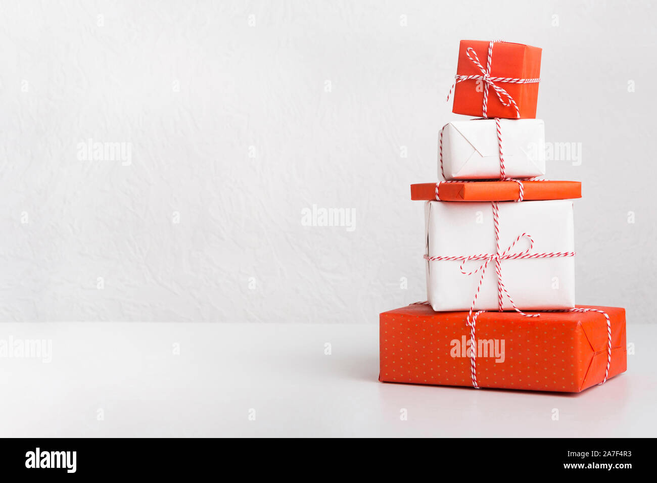 Gift boxes packed in craft colored paper Stock Photo - Alamy