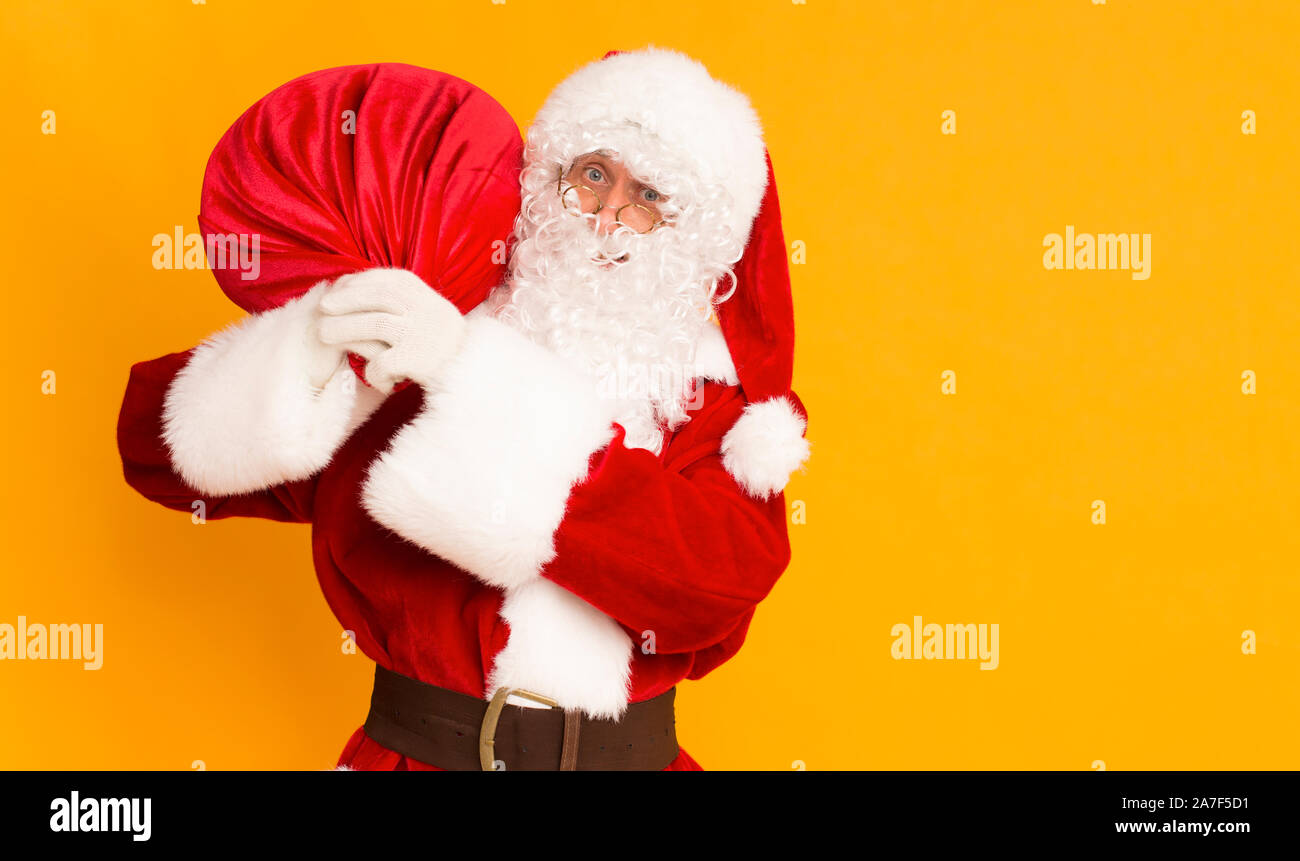Santa claus carrying big bag hi-res stock photography and images - Alamy
