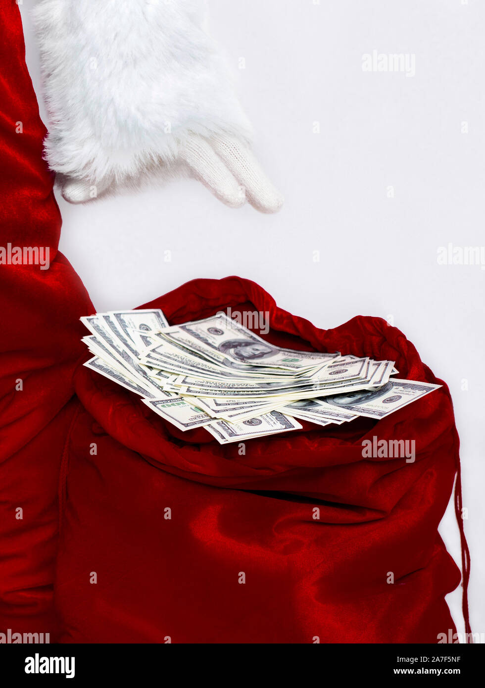 Big Santa's bag full of dollars on white background Stock Photo - Alamy