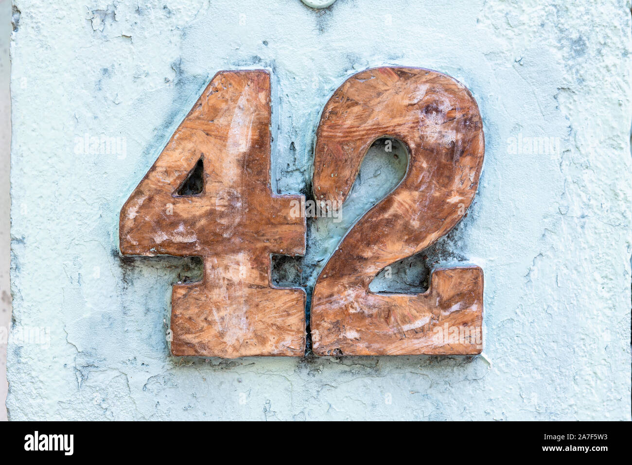 Street number sign on the wall Stock Photo - Alamy