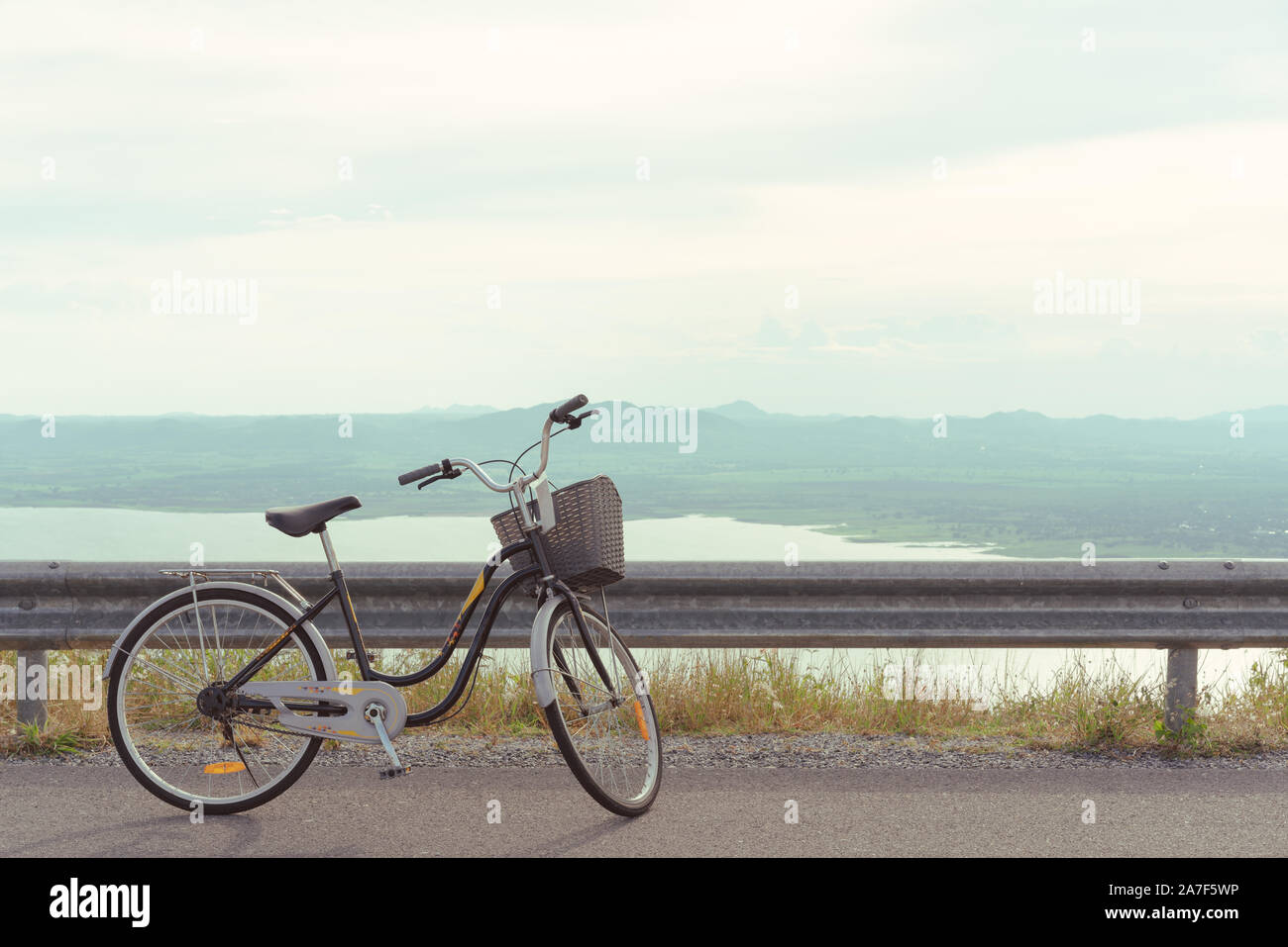 Stationary bicycle on cycle path with amazing scenic views of a lake ...