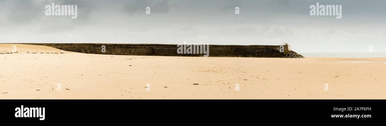 A panorama view of a minimalist abstract landscape of stone harbor wall ...
