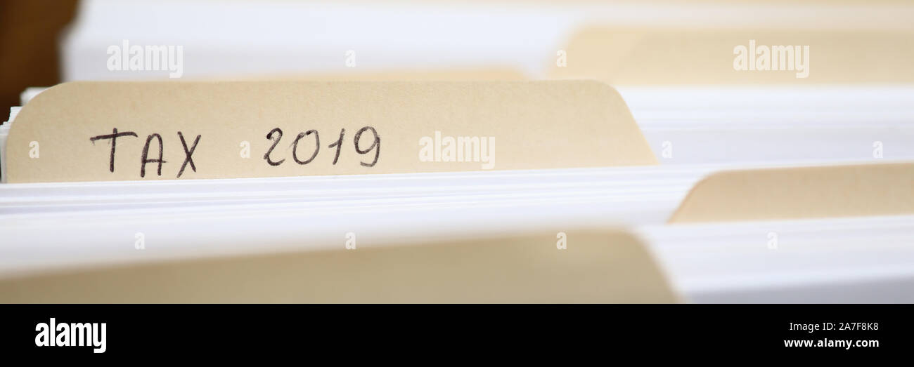 Paper folder of tax form 2019 financial report Stock Photo - Alamy