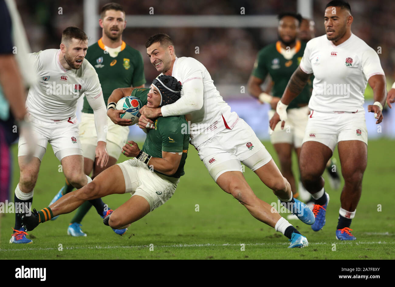 England's Jonny May (right) tackles South Africa's Cheslin Kolbe during ...