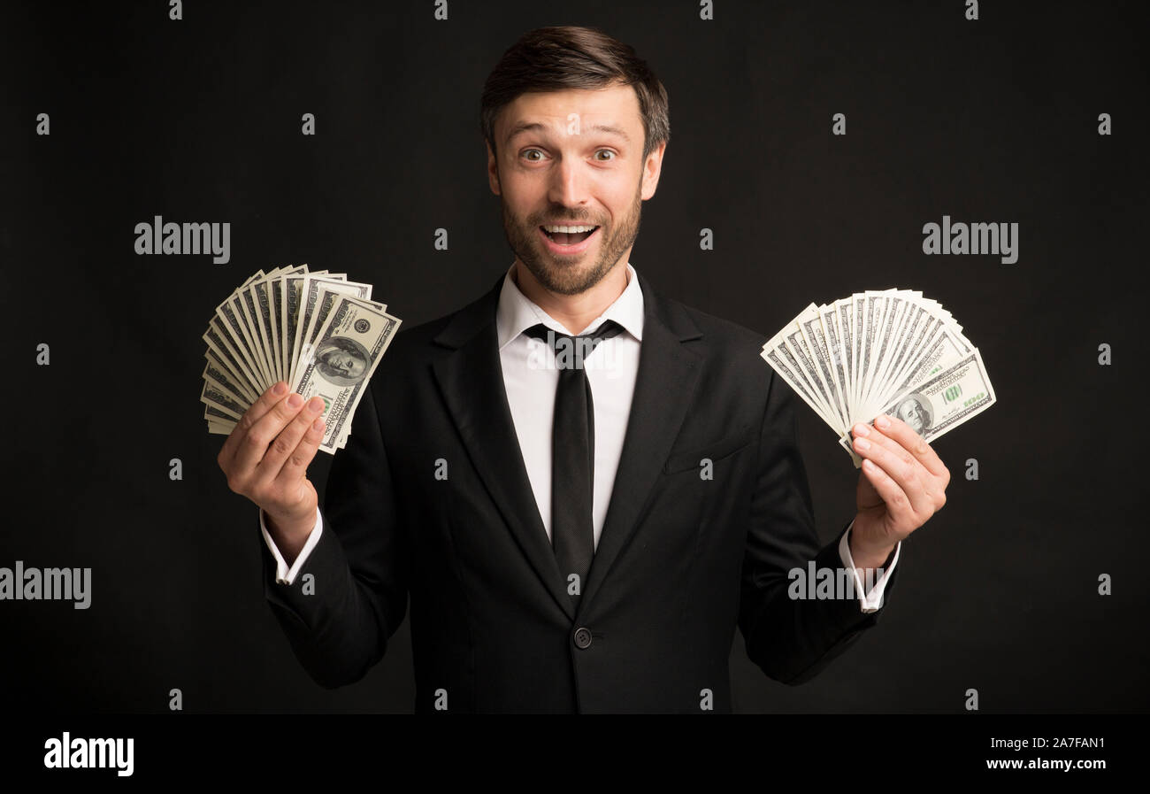 Excited Businessman Holding Money Cash Standing, Black Background ...