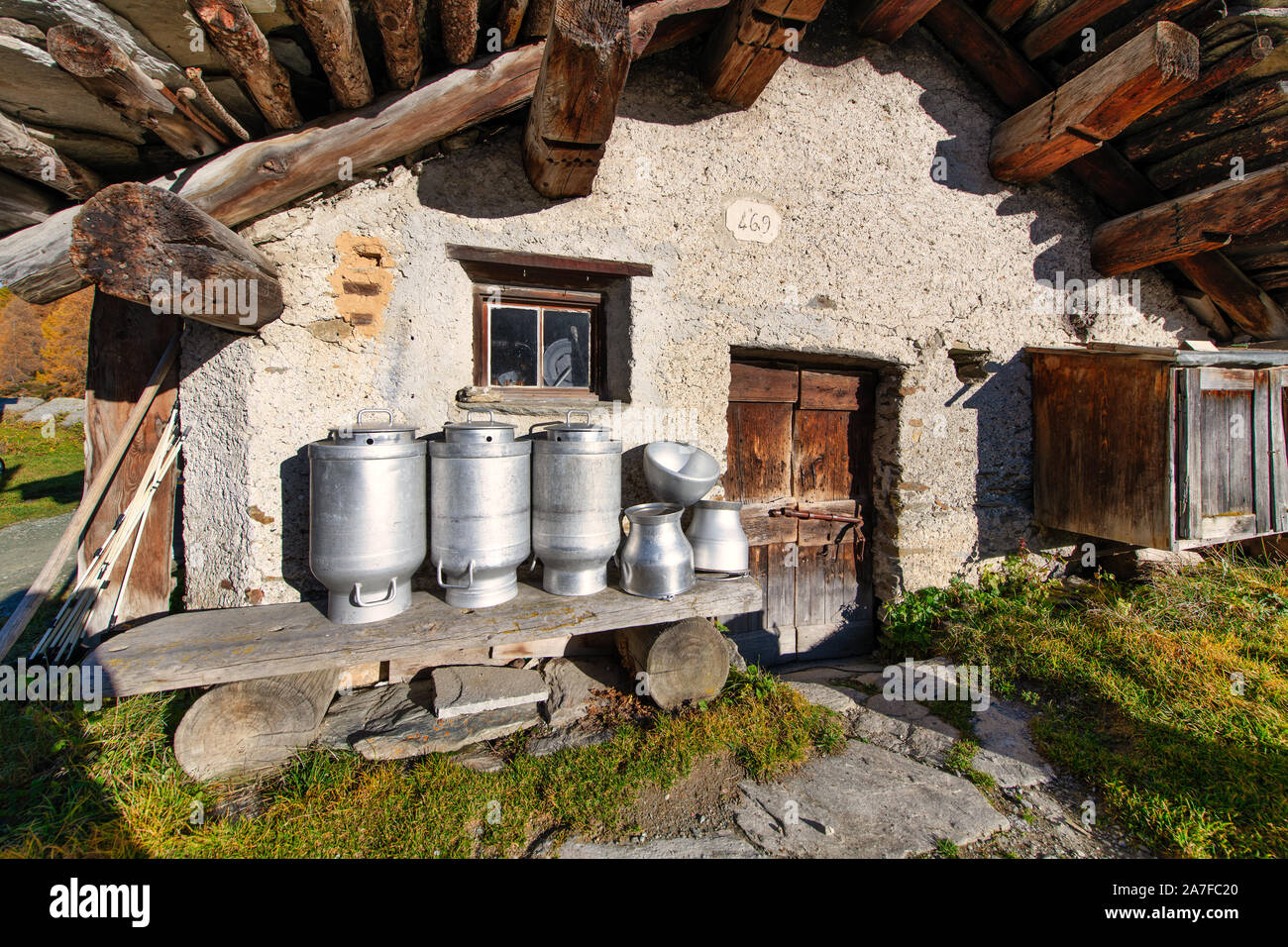 Hut of cow farmers with milk containers Stock Photo - Alamy