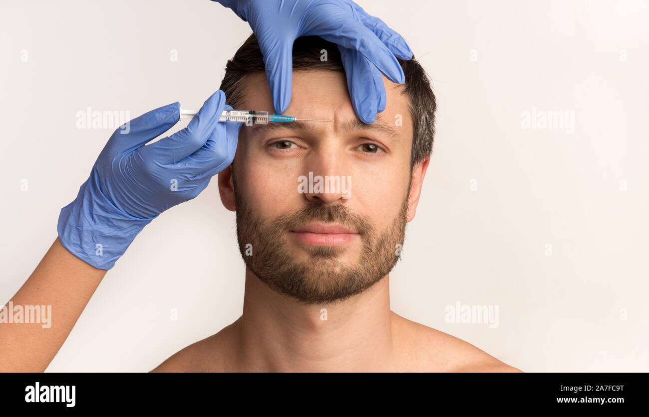 Young guy receiving injection hi-res stock photography and images - Alamy