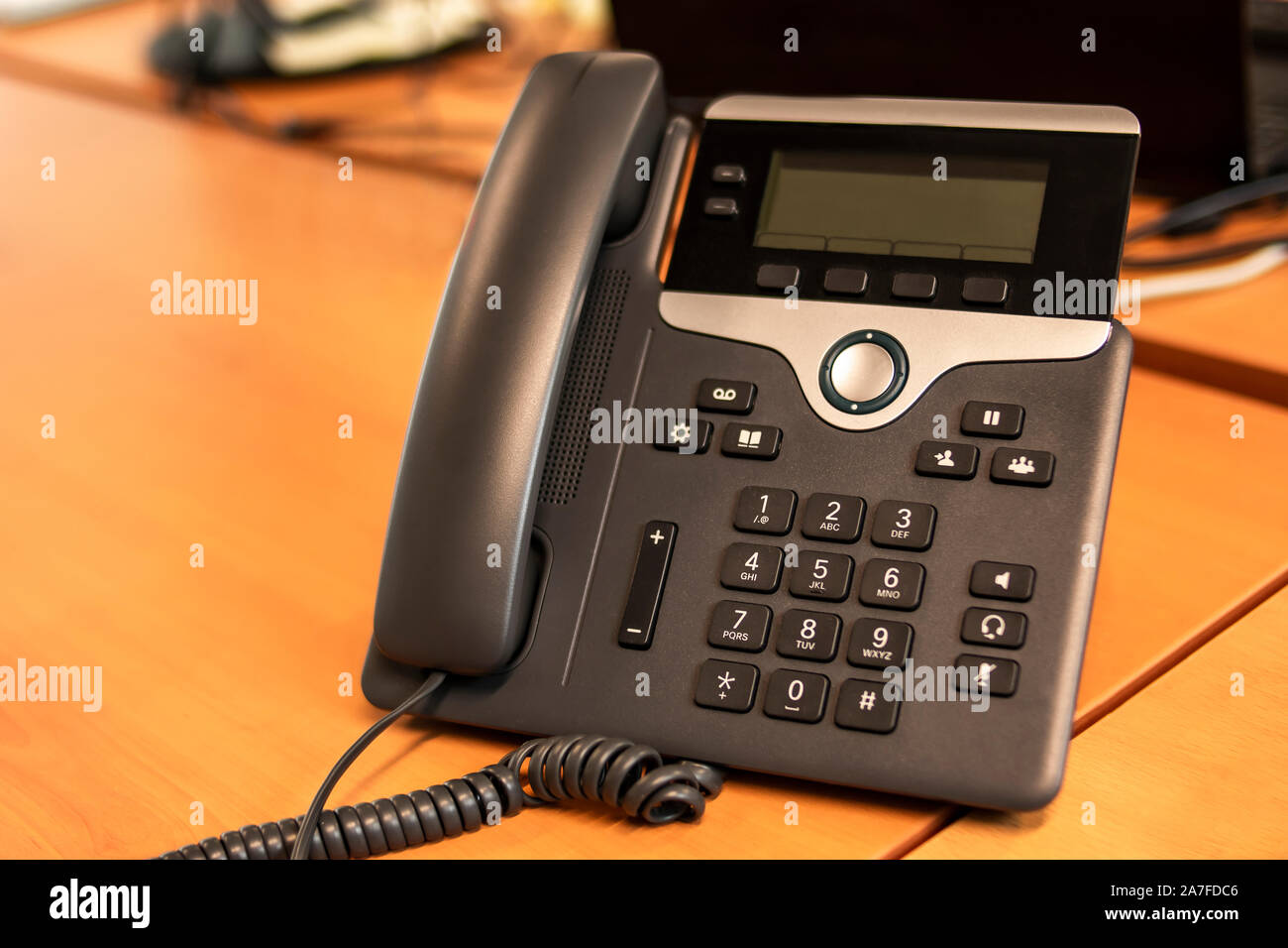 Office IP telephone set with big LCD at office desk Stock Photo - Alamy