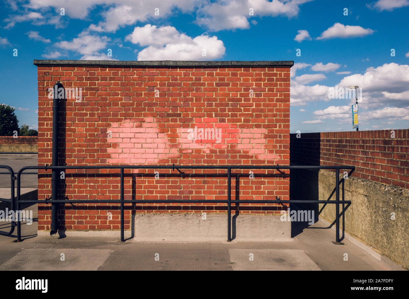 Painted brickwork reflecting the pattern of clouds in the sky Stock ...