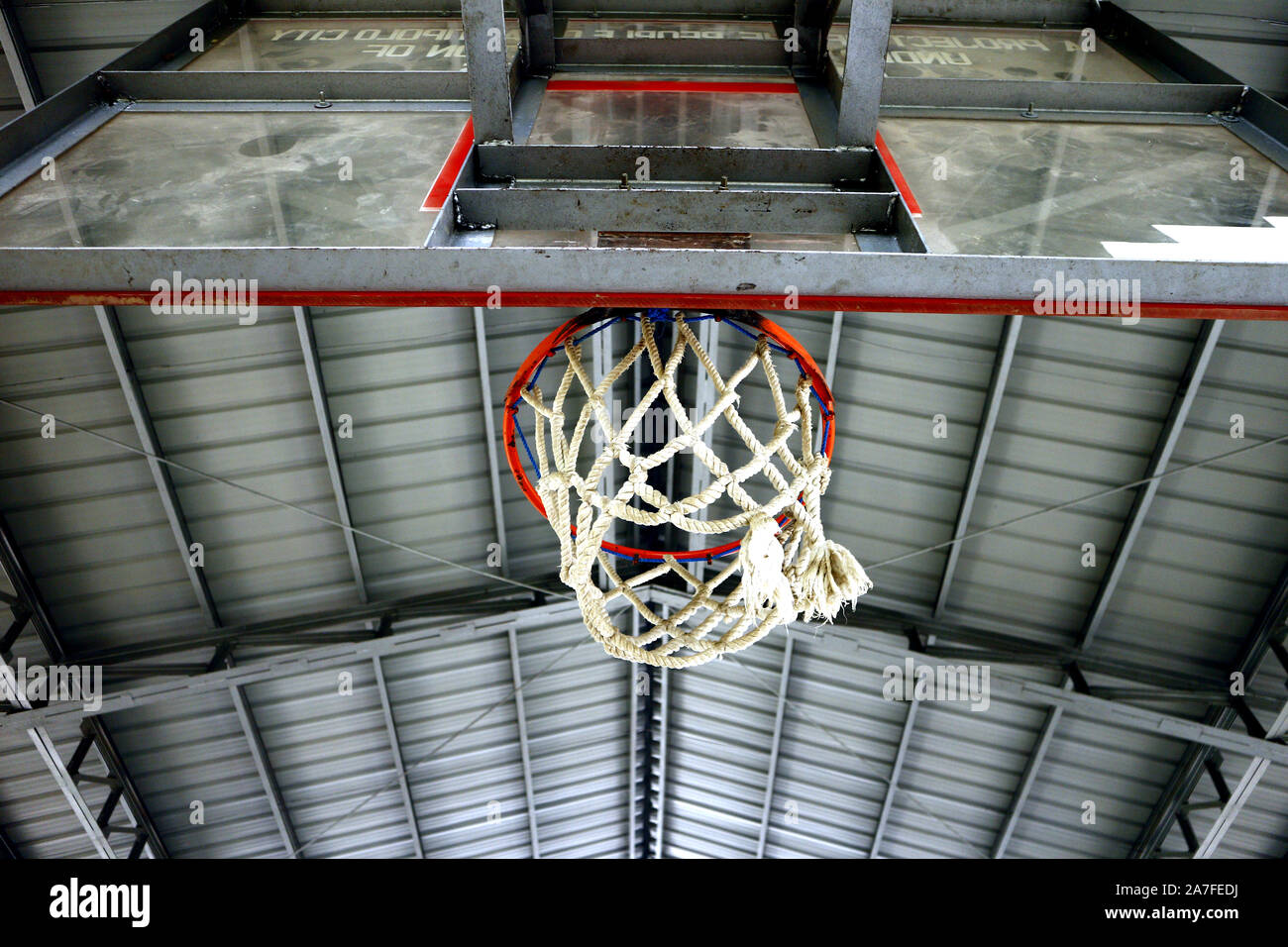 Photo of a basketball ring at a covered basketball court Stock Photo ...