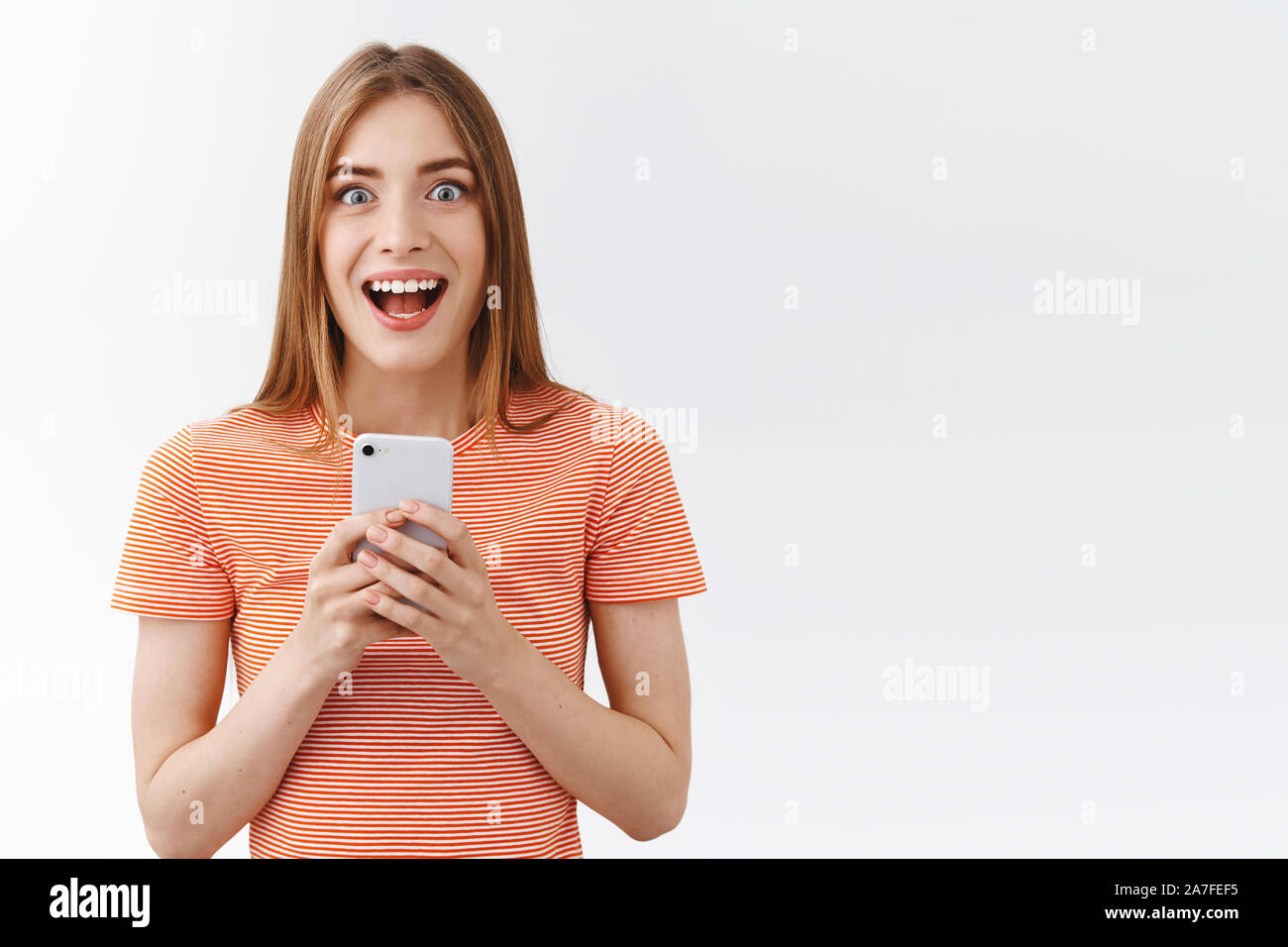 Holding phone to chest hi-res stock photography and images - Alamy