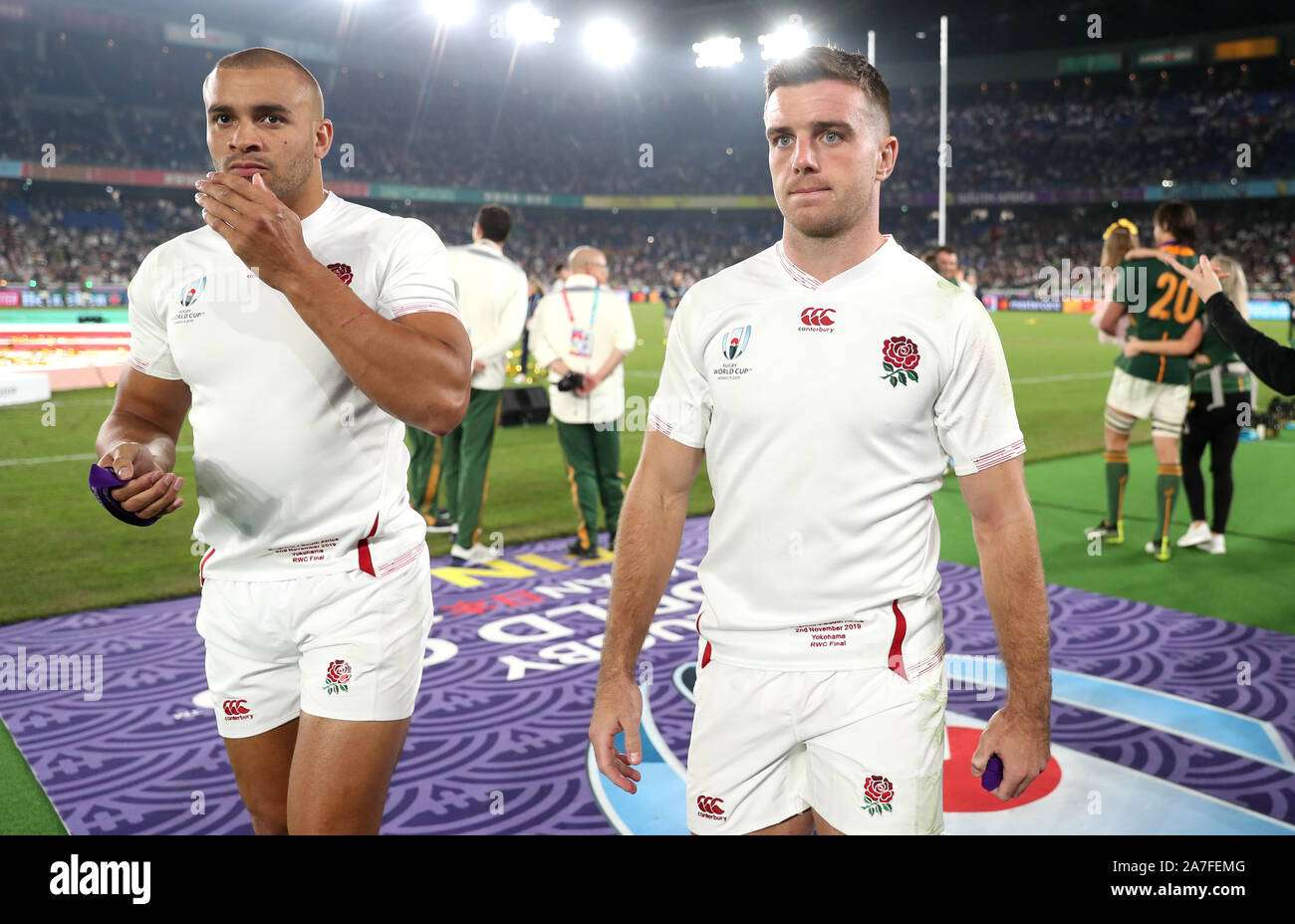 England's Jonathan Joseph (left) and George Ford react after the 2019 ...