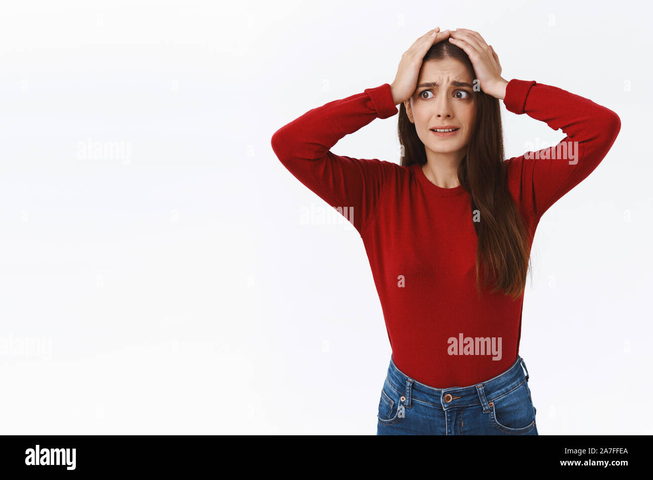 Freak-out alarmed young troublesome brunette girl in red sweater, grab ...
