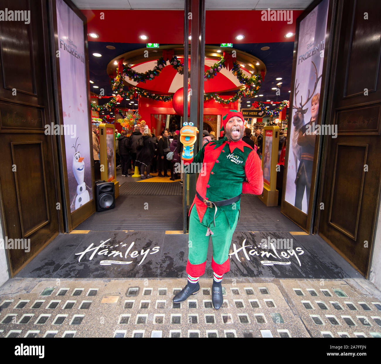 Westminster, London, UK. 2nd November 2019. Santas elf shelters from ...