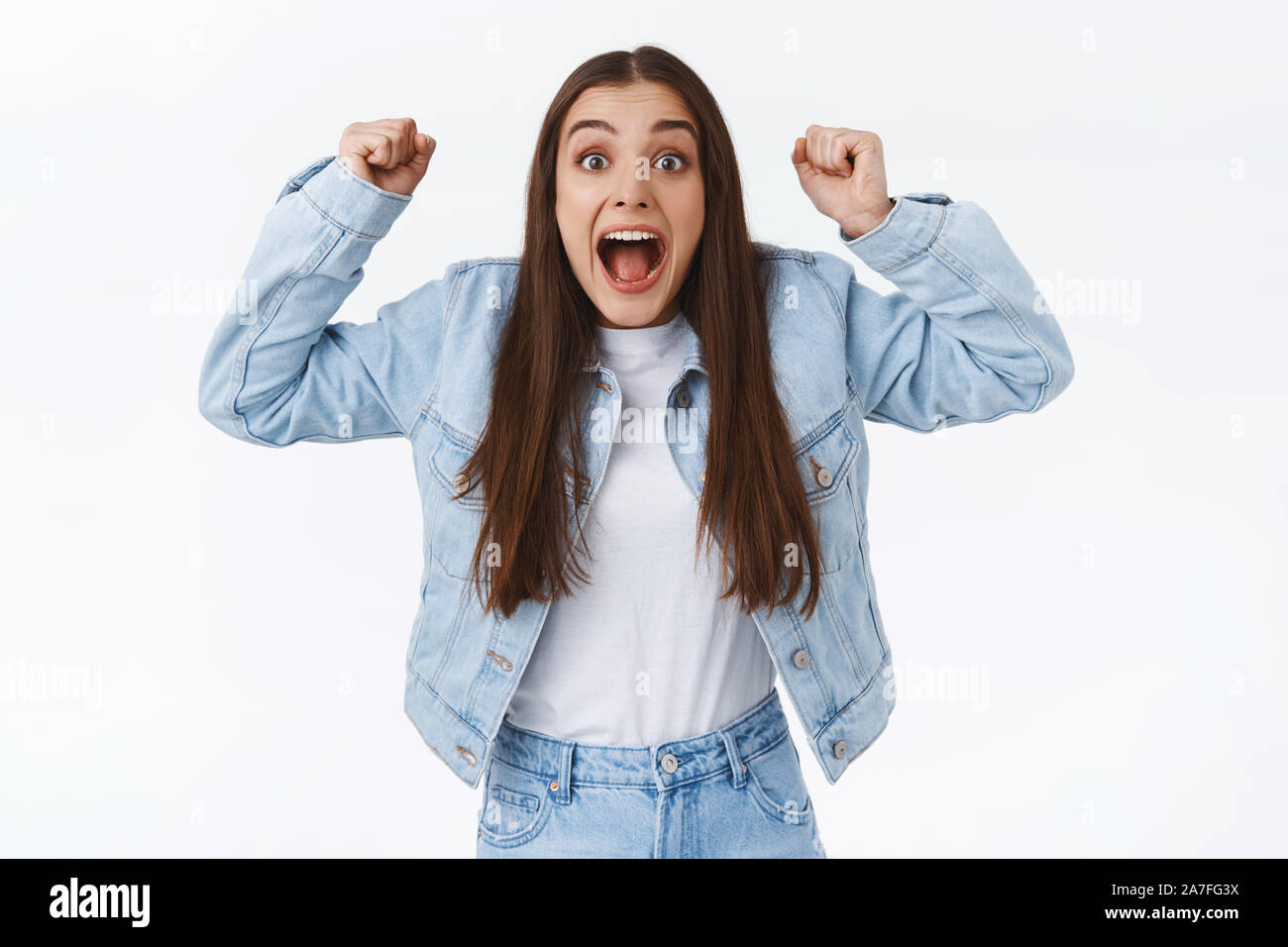 Cheerful and excited woman cheering, triumphing as receiving award ...