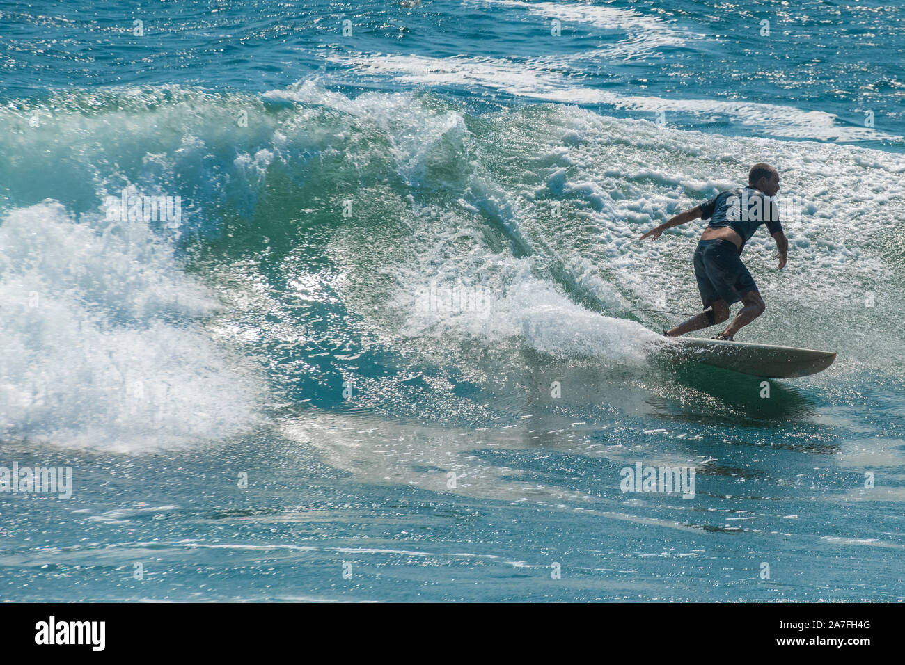 Surfing in the beautiful sea that surrounds Tap Mun Island (also known ...