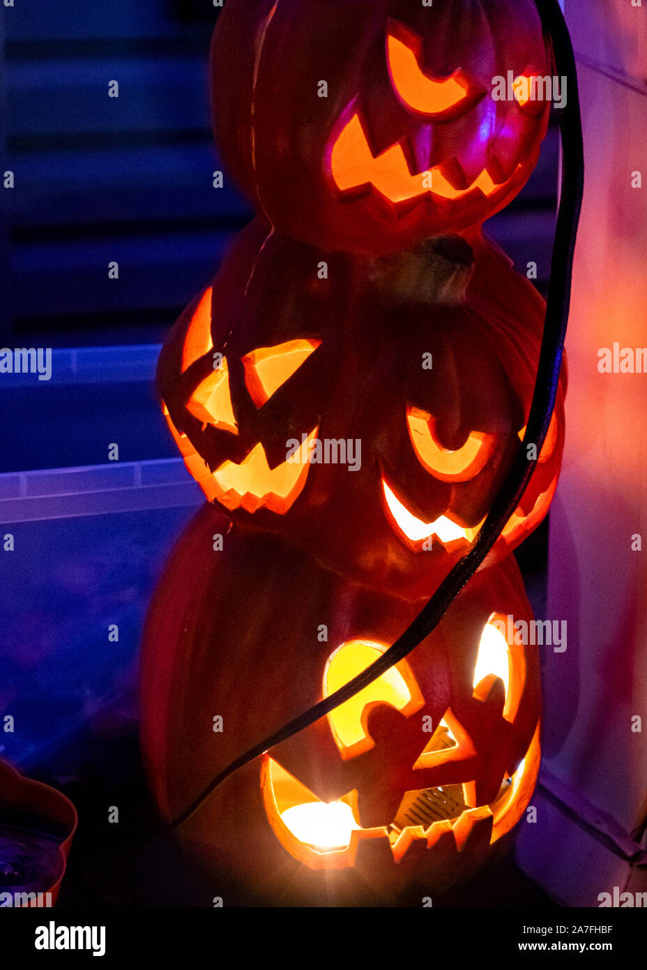 Illuminated carved pumpkin totem pole - Halloween decorations in ...