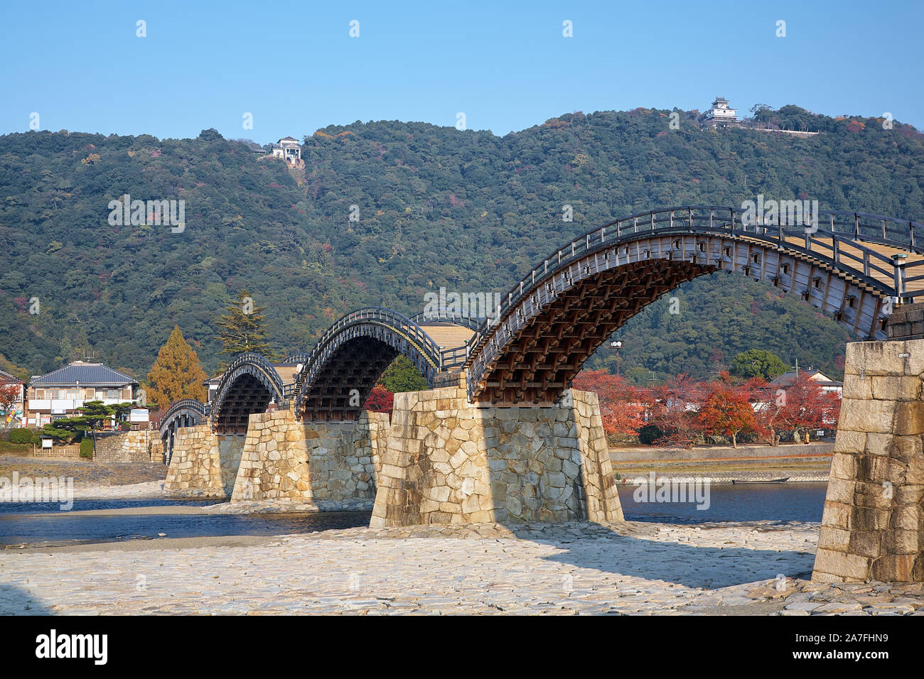The view of the historical wooden Kintai arch bridge over Nishiki river ...
