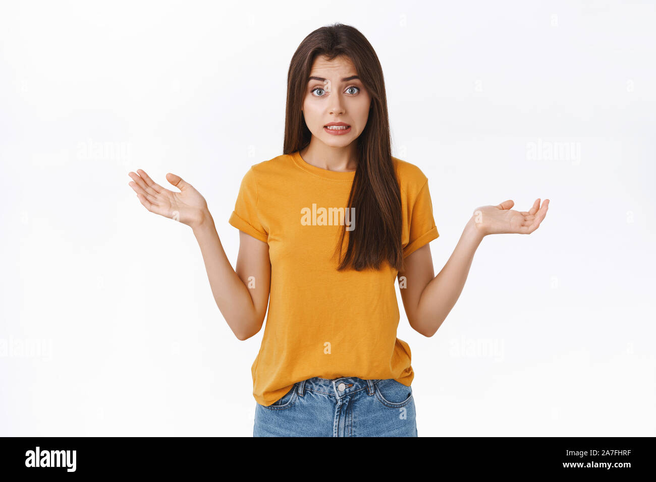 Puzzled, awkward and embarrassed silly girl making mistake saying oops ...