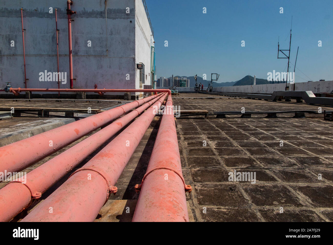 Pipes on a rooftop office block in Hong Kong Stock Photo - Alamy