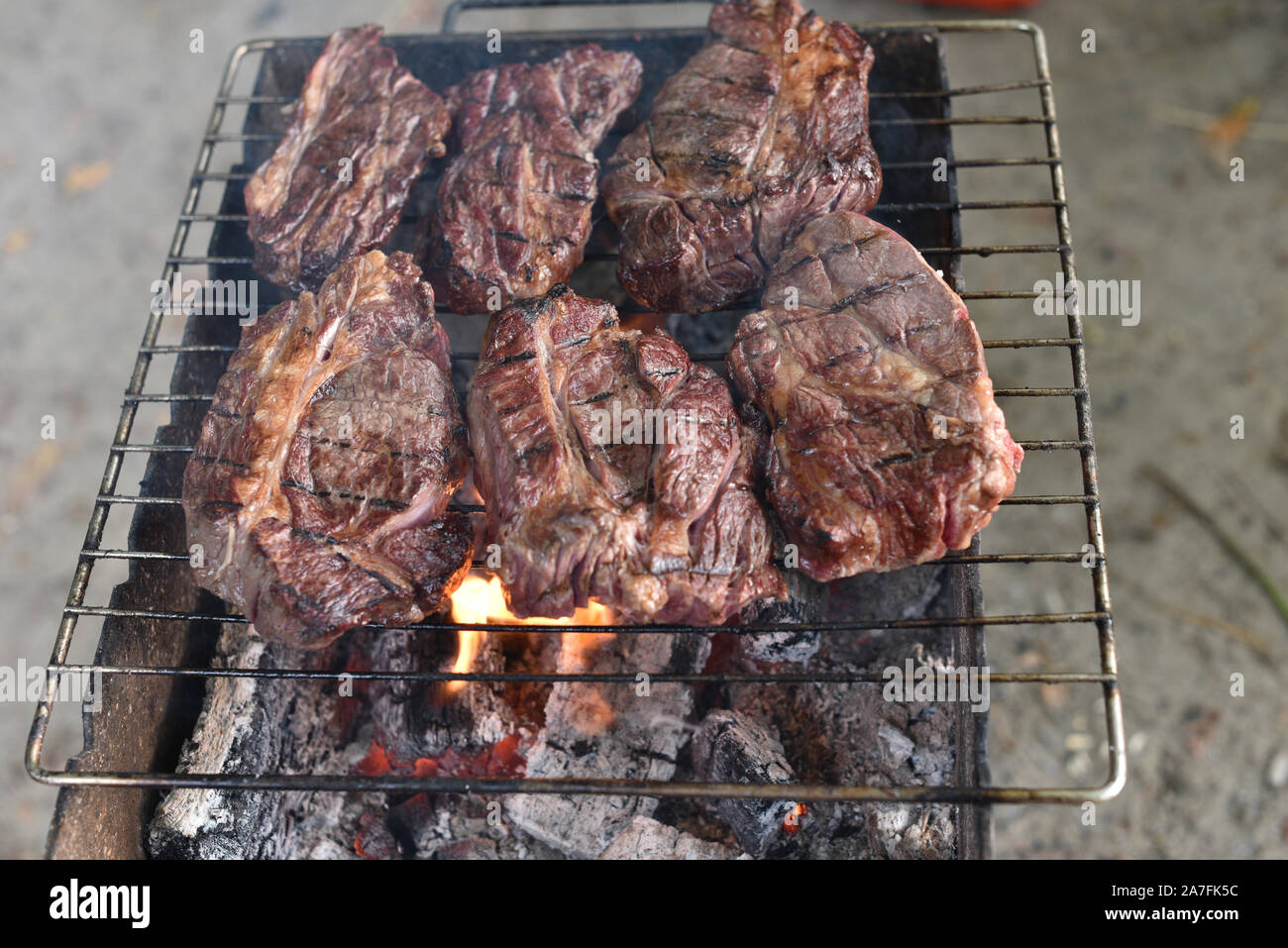 Chuck roll steak. grilled chuck roll. Cooking meat by a professional ...