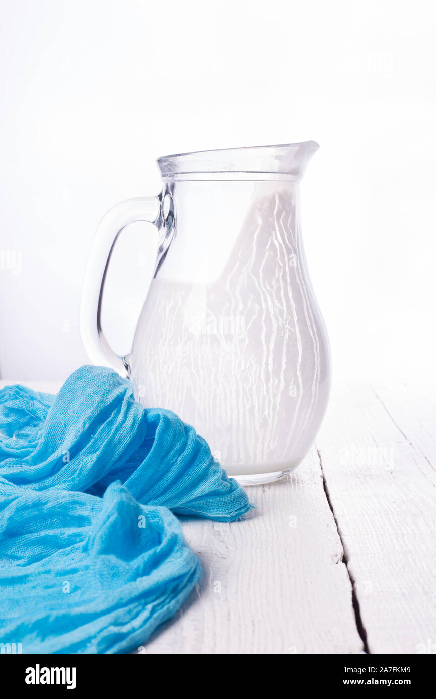 Empty pitcher in which was yogurt on a light background Stock Photo - Alamy