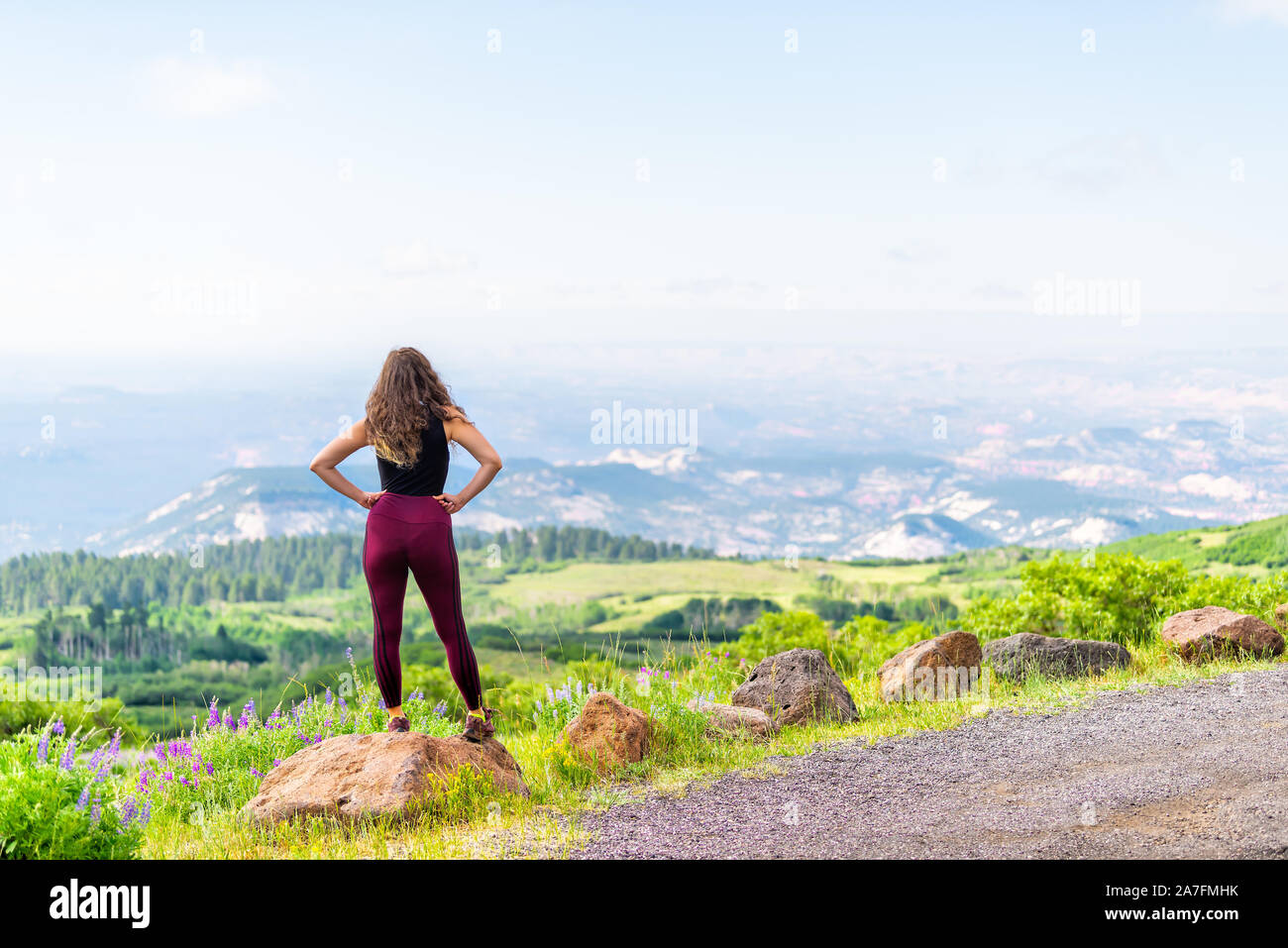 Woman looking at view of canyon formations landscape on highway 12 ...