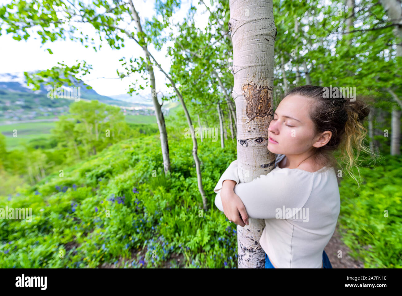 Tree hugging hippy hi-res stock photography and images - Alamy