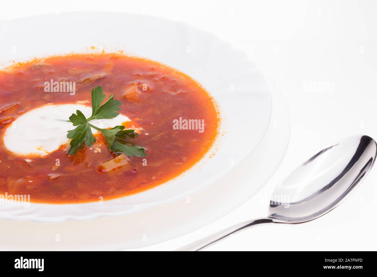 Ukrainian borsch in the plate over white Stock Photo - Alamy