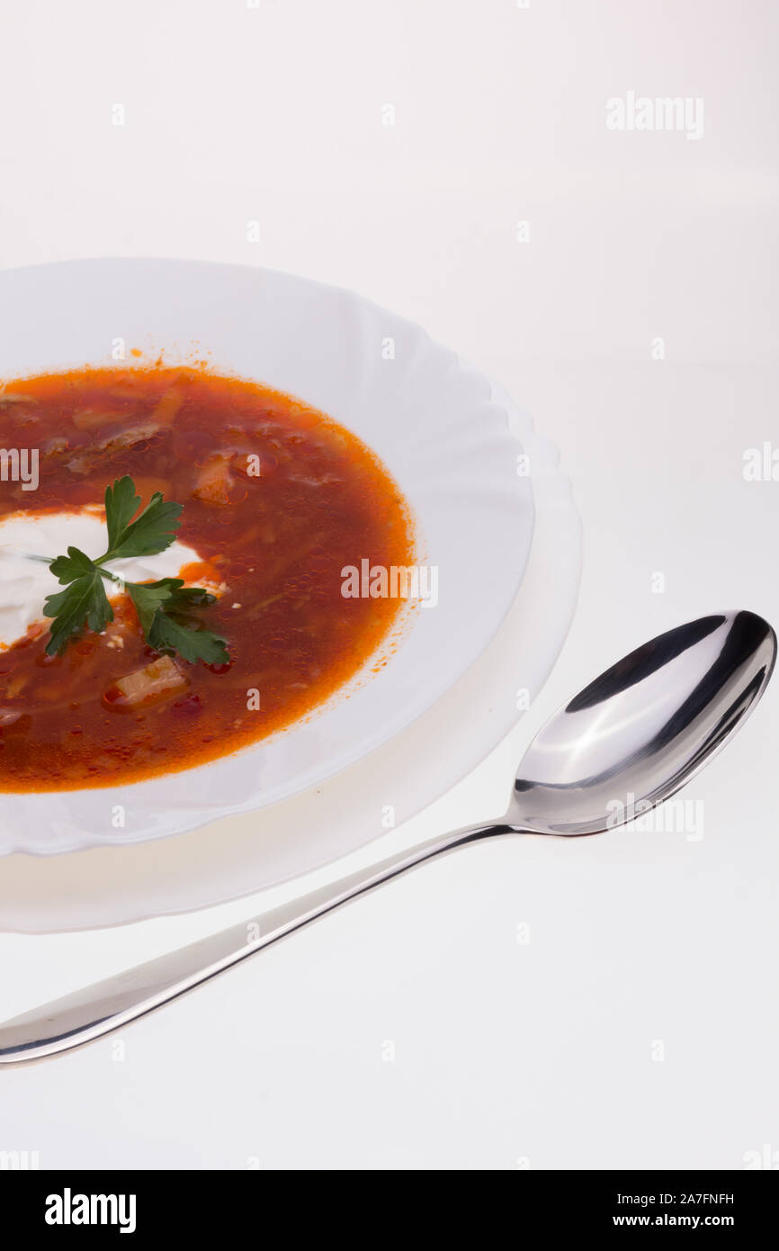 Ukrainian borsch in the plate over white Stock Photo - Alamy