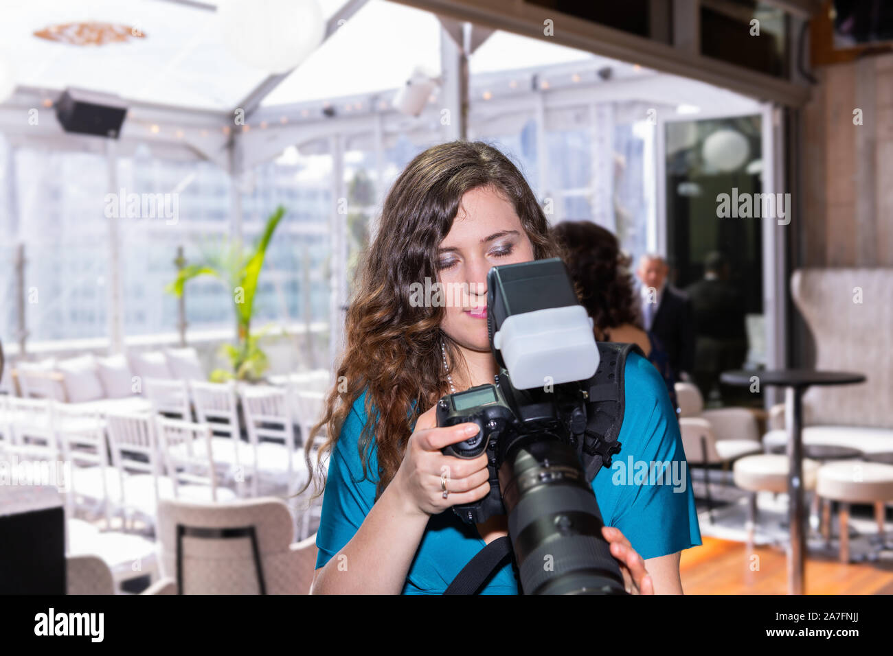 One young wedding photographer woman girl standing with camera external ...