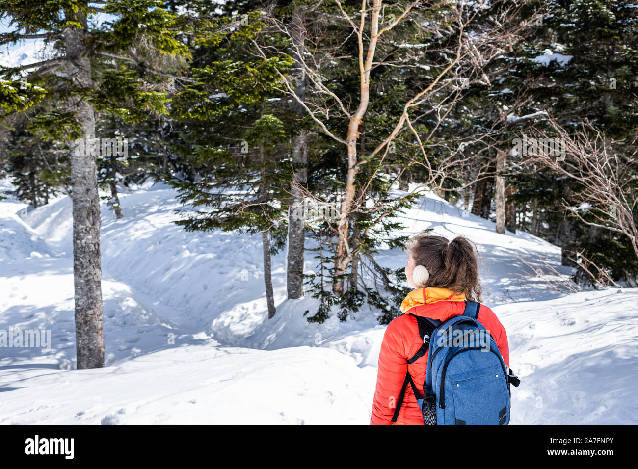 Young woman on mountain trail with snow in Okuhida villages Shinhotaka ...