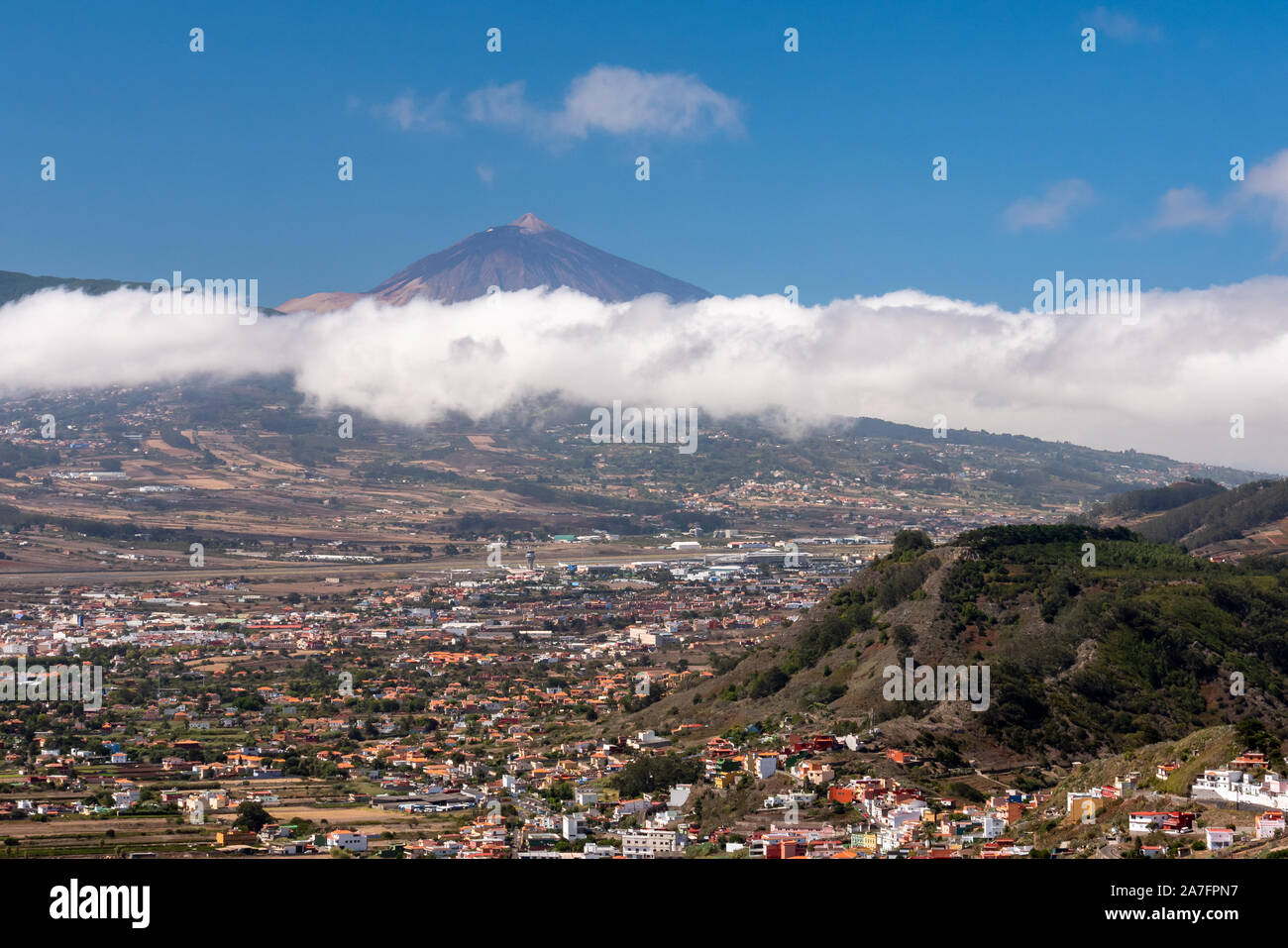 view of the volcano Teide and the city of San Cristobal de La Laguna ...