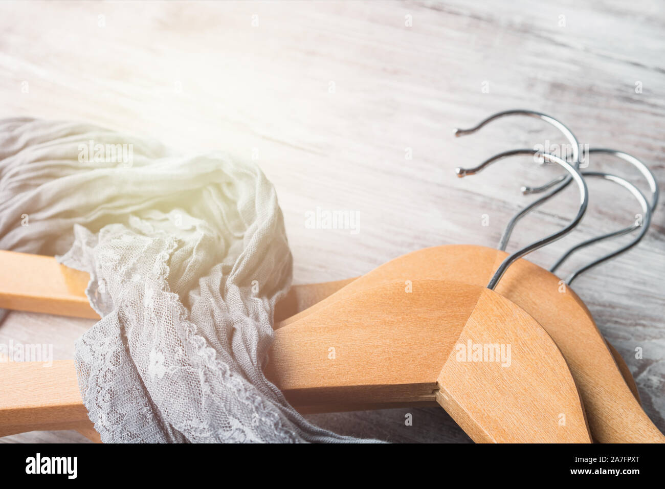 Wooden clothes hangers on bright background. What nothing to wear ...