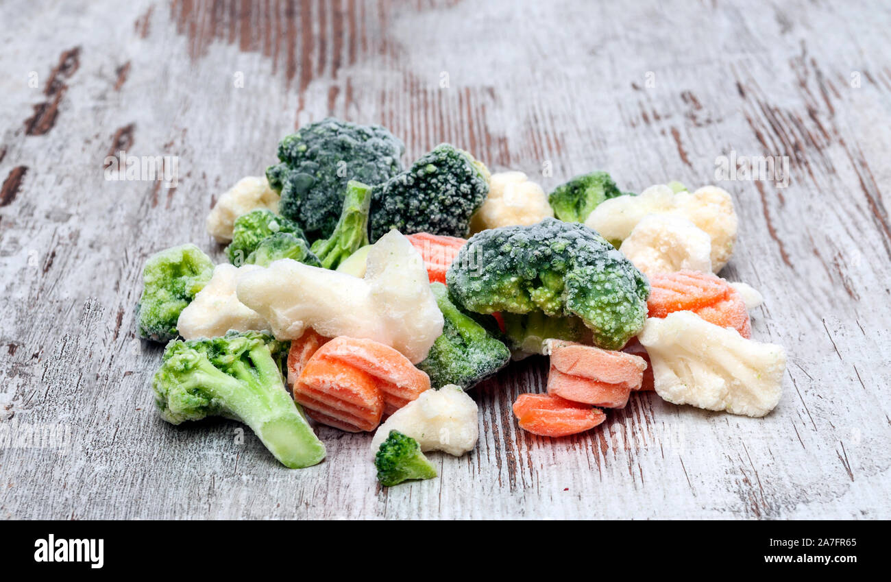 Vegetables served on a plate surrounded byrustic background Stock Photo ...