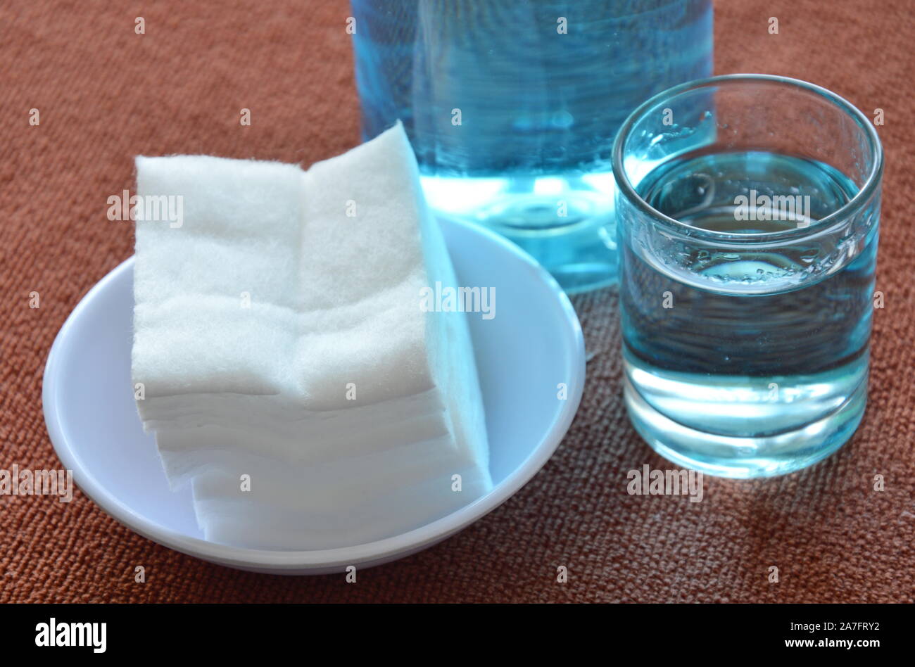 blue alcohol for wash wound in glass and cotton Stock Photo - Alamy